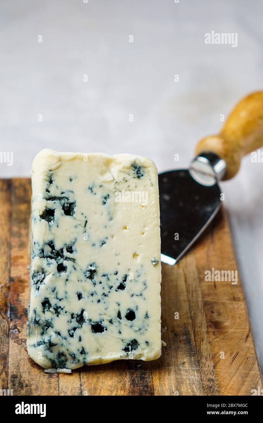 Wedge of blue cheese Stock Photo - Alamy