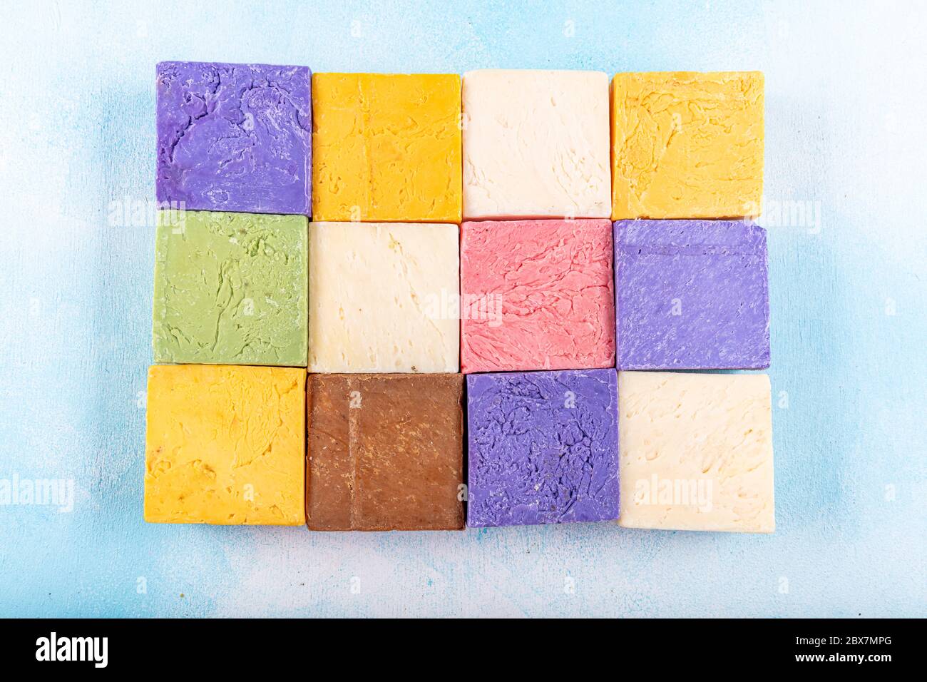 Homemade soaps. Variety of colorful handmade soap bars on wooden ...