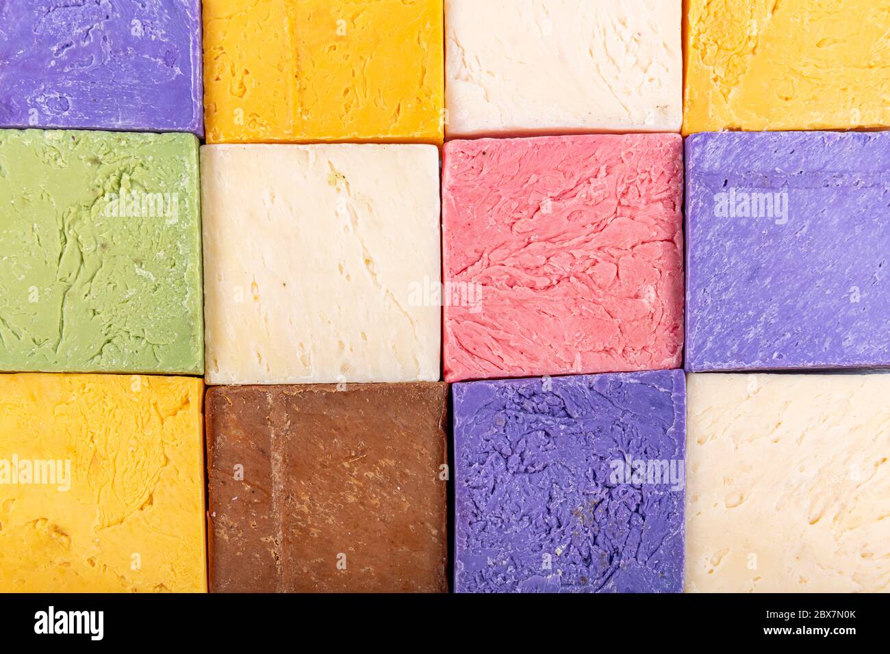 Homemade soaps. Variety of colorful handmade soap bars on wooden ...