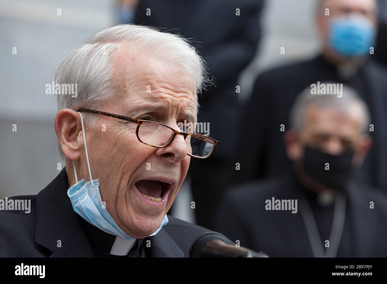 Father MICHAEL G RYAN speaks during a vigil at St. James Cathedral in ...