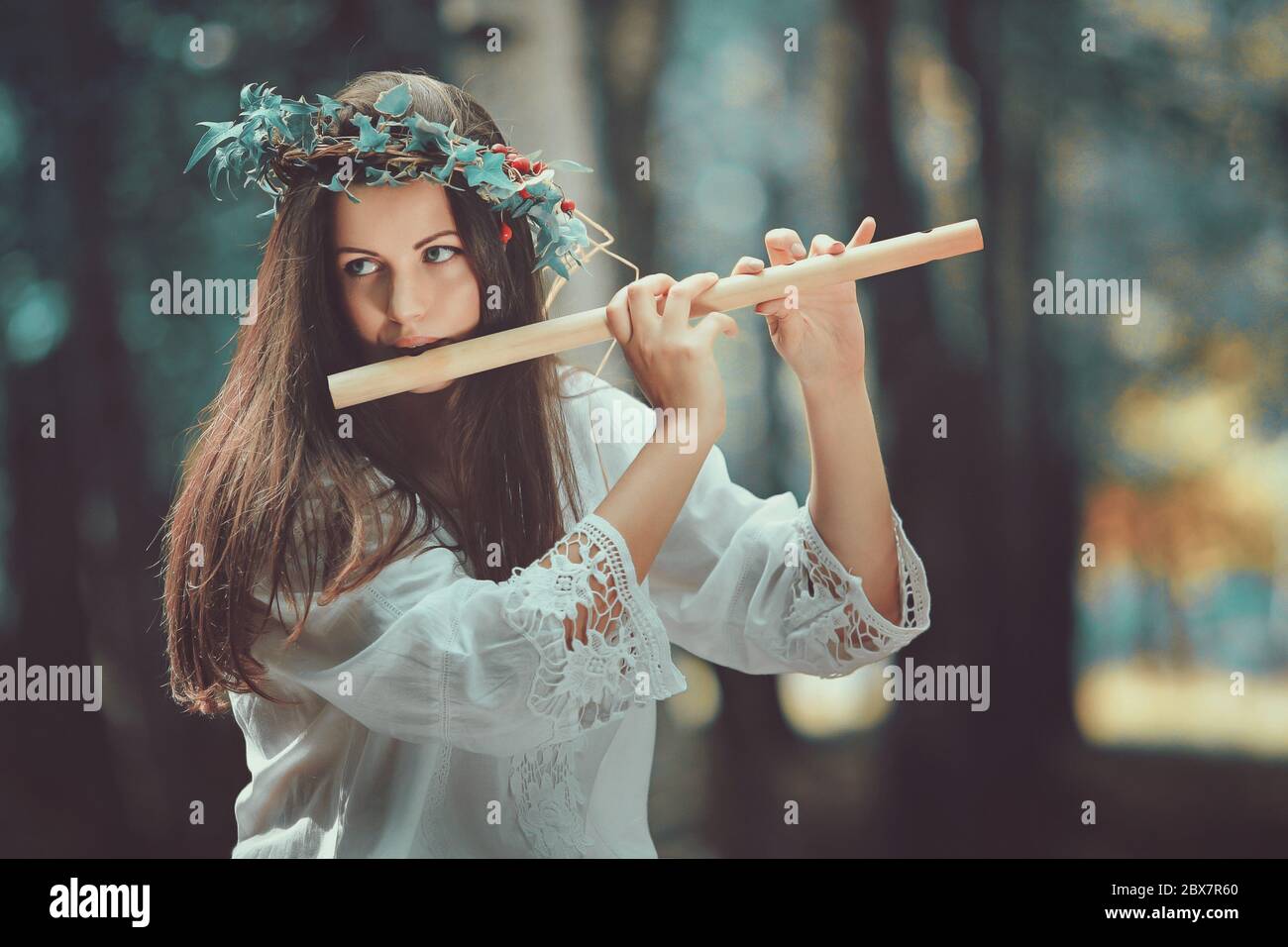 Young woman playing flute hi-res stock photography and images - Alamy