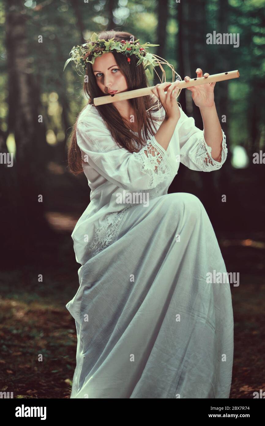 Young woman playing flute hi-res stock photography and images - Alamy