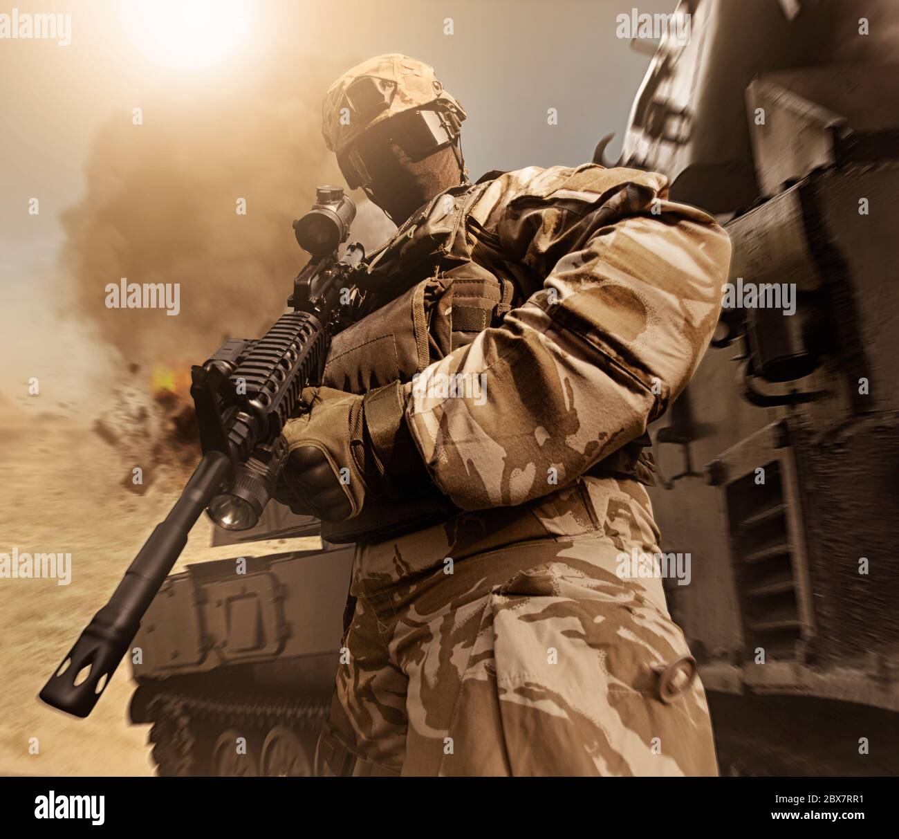 Military fully equipped soldier in outfit posing with rifle on war tank ...