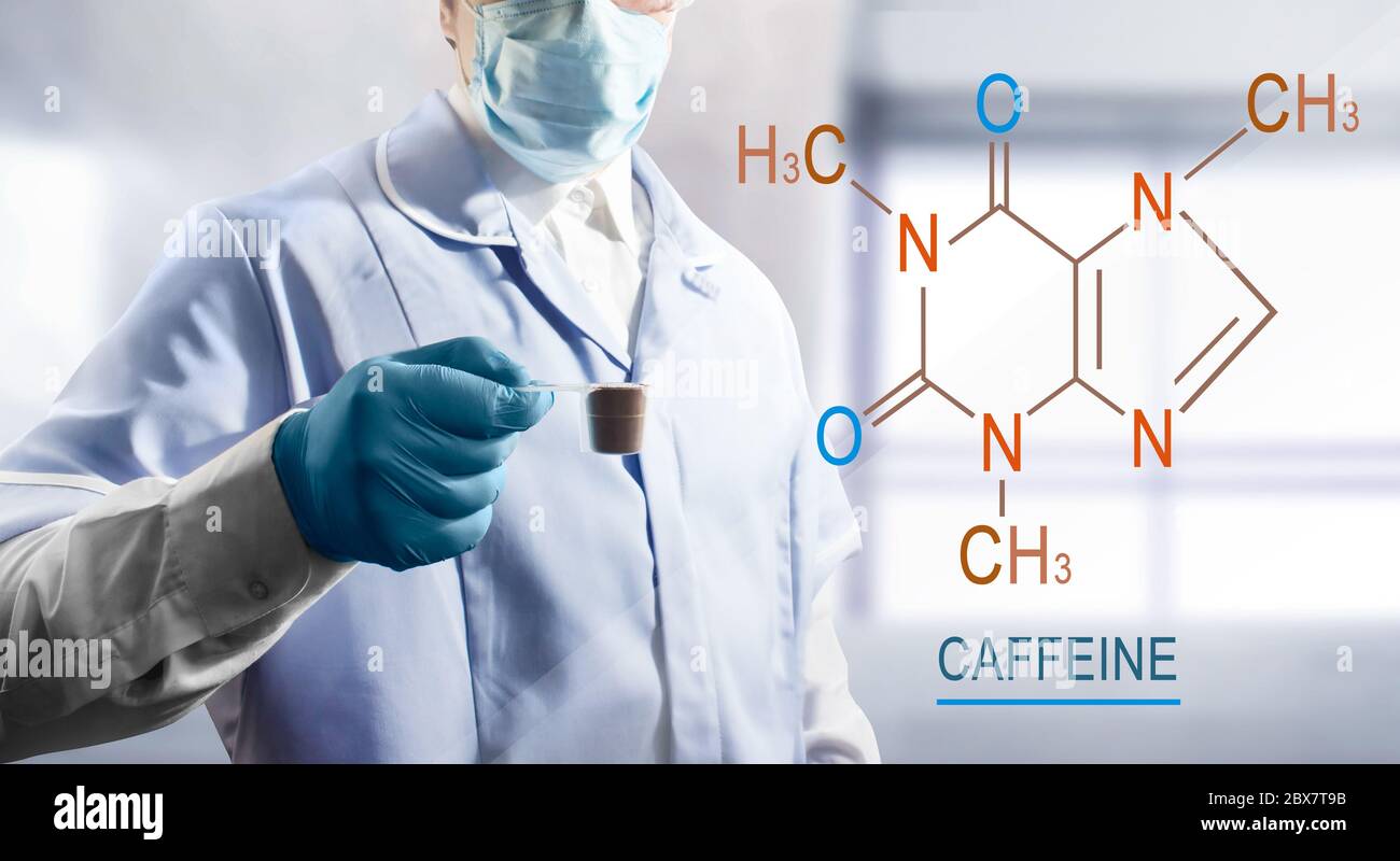Photo of a lab assistant holding a coffee in measuring cup with ...