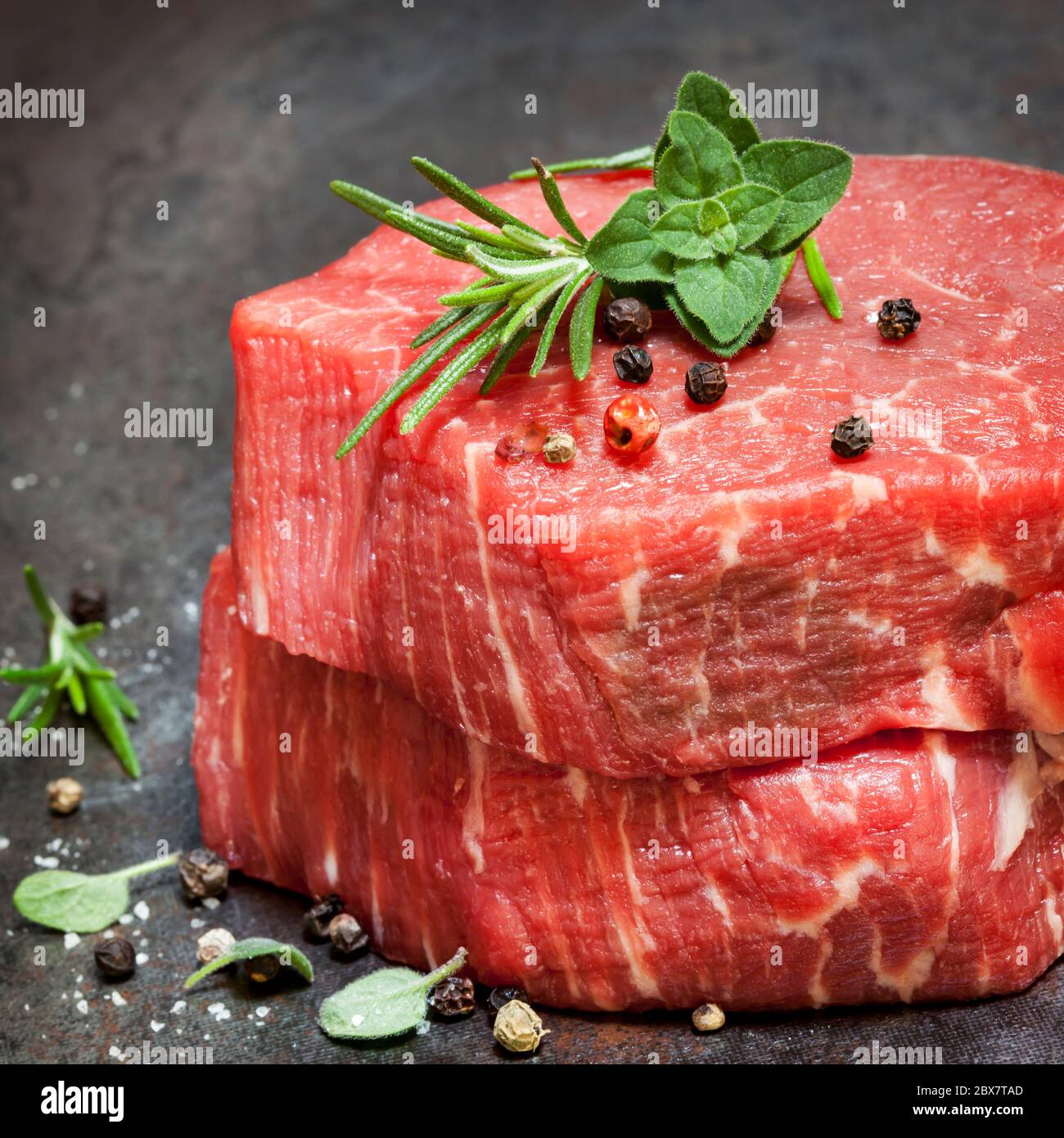 Raw beef fillet steaks with herbs and spices Stock Photo - Alamy