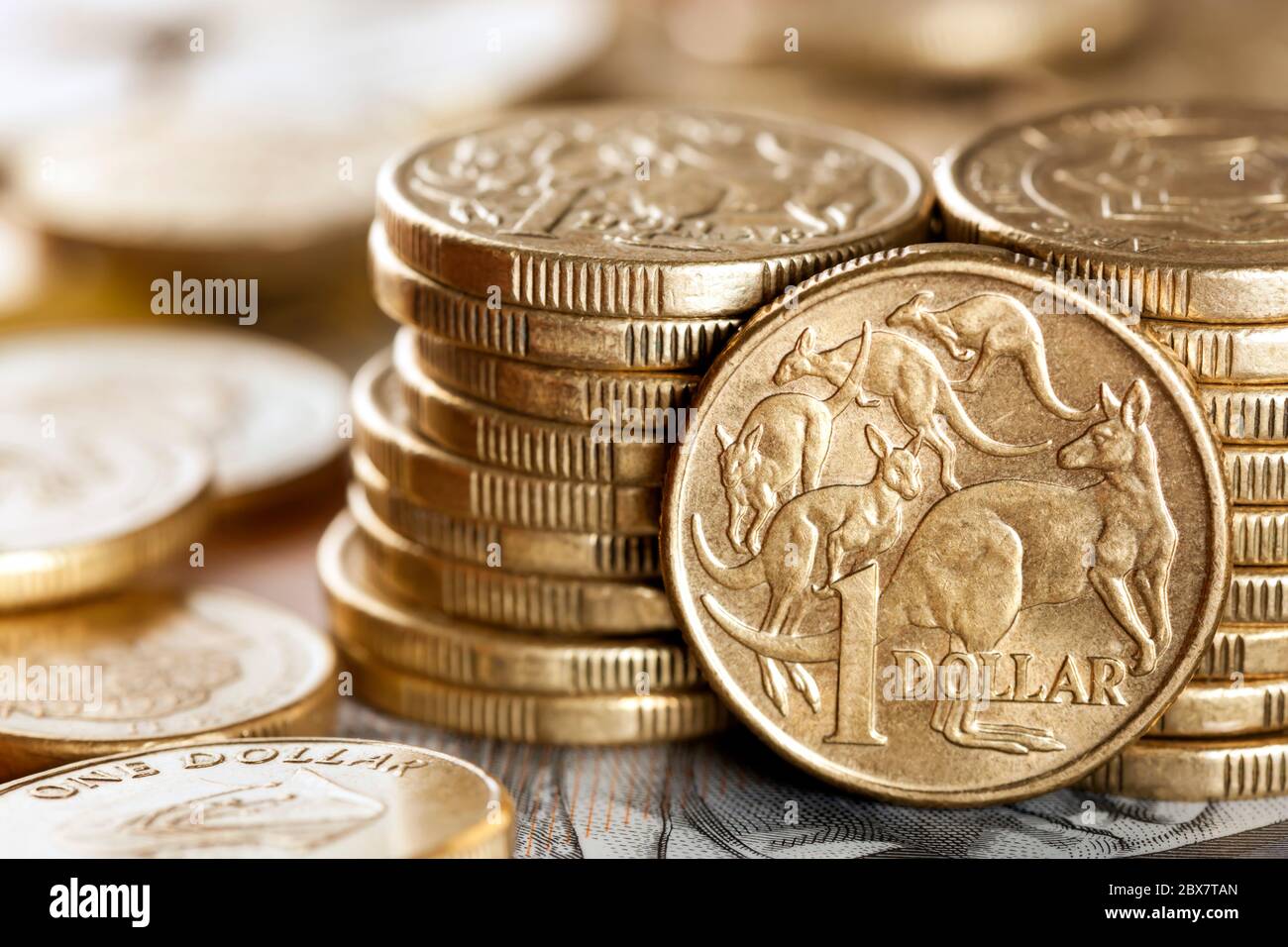Stacks of Australian one dollar coins. Focus on front coin Stock Photo ...