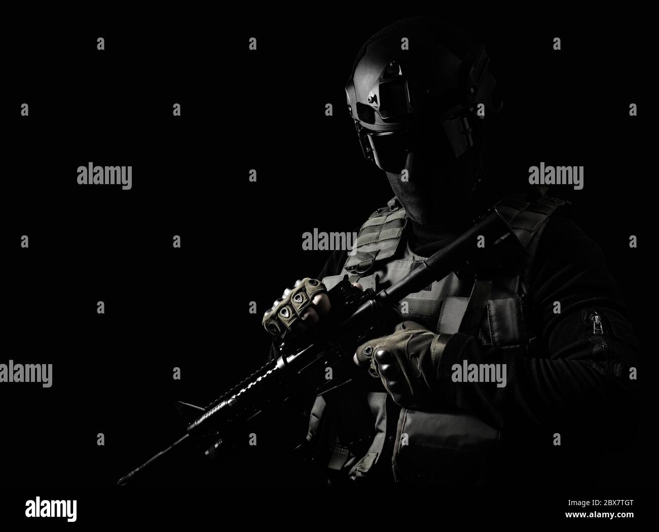 Black and white photo of equipped swat soldier standing with rifle on ...