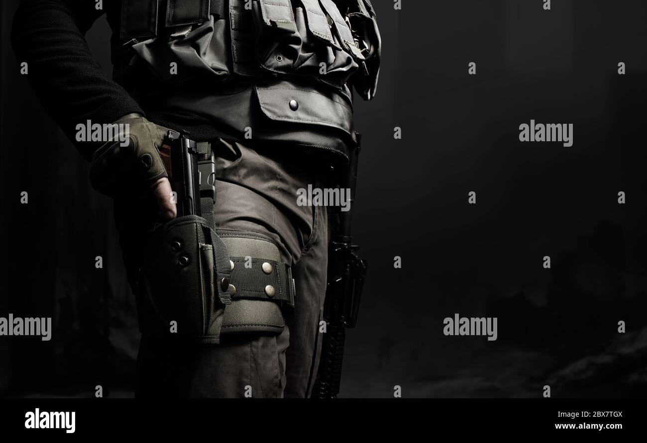 Closeup black and white photo of equipped swat soldier holding a gun ...