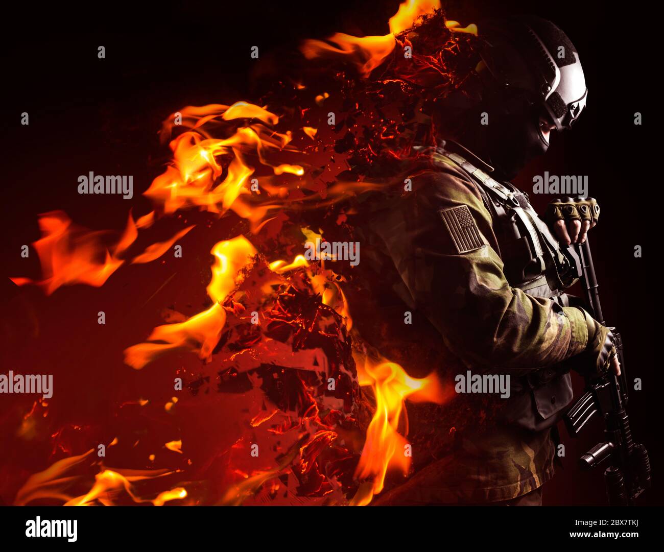 Profile view photo of a swat soldier with fire dissolving effect on ...
