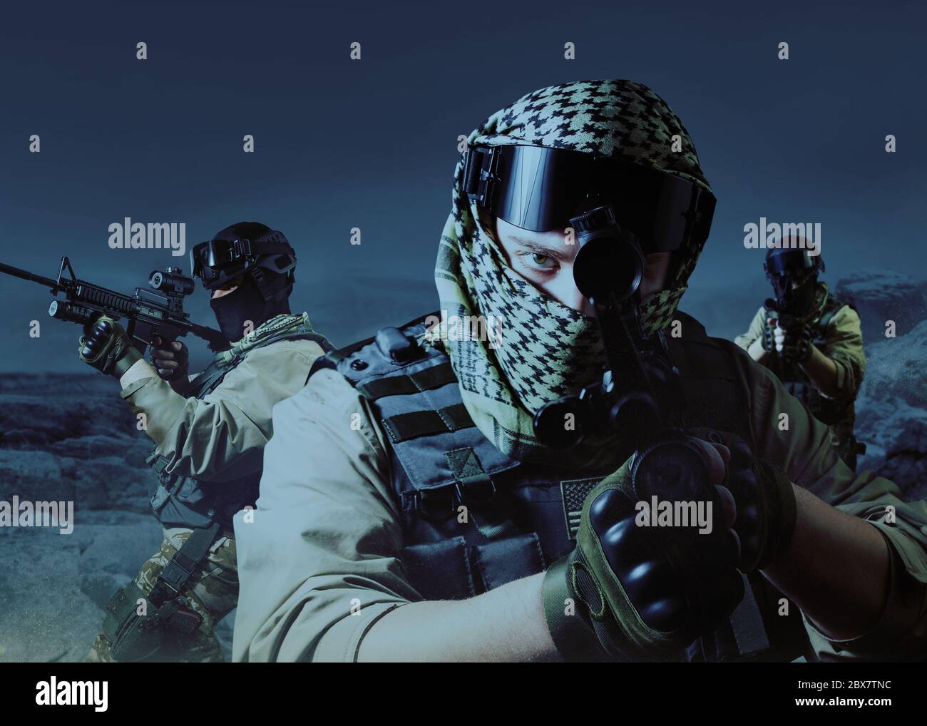 Special operation military soldiers posing on night desert background ...