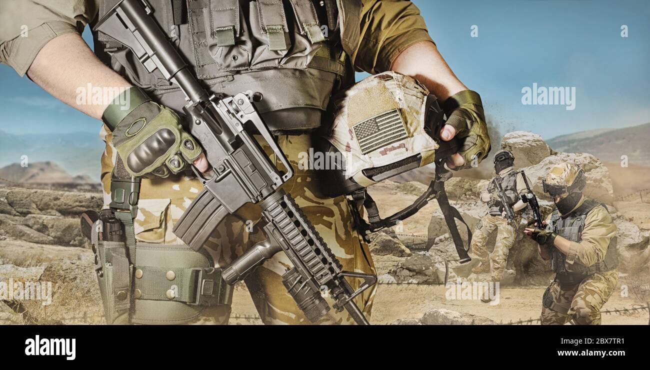 Photo of a fully equipped soldiers posing with guns and rifles on a ...