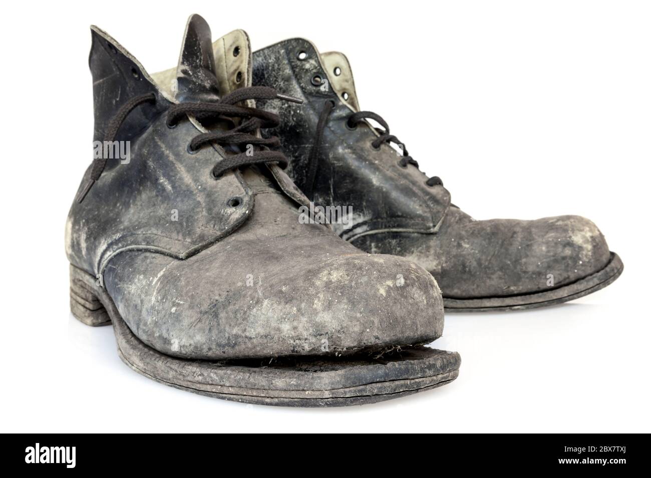 Old Boots, isolated on white background Stock Photo - Alamy