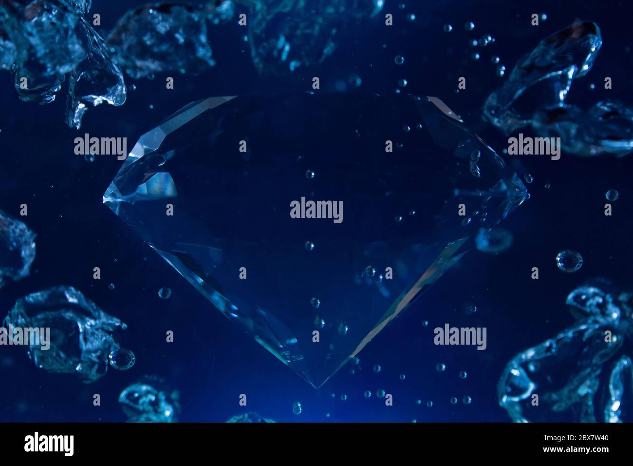 Photo of a blue diamond in water with bubbles floating Stock Photo - Alamy