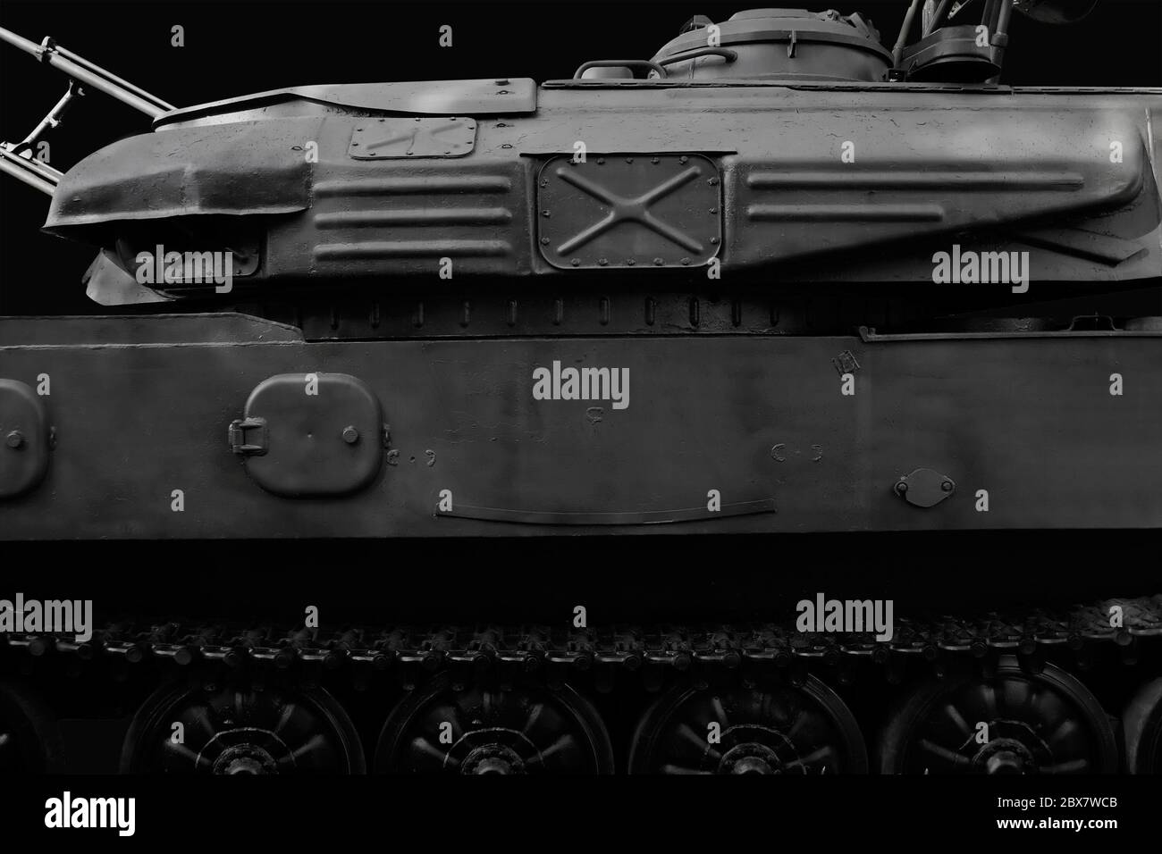 Black & white photo of an armored war battle tank profile view on dark ...