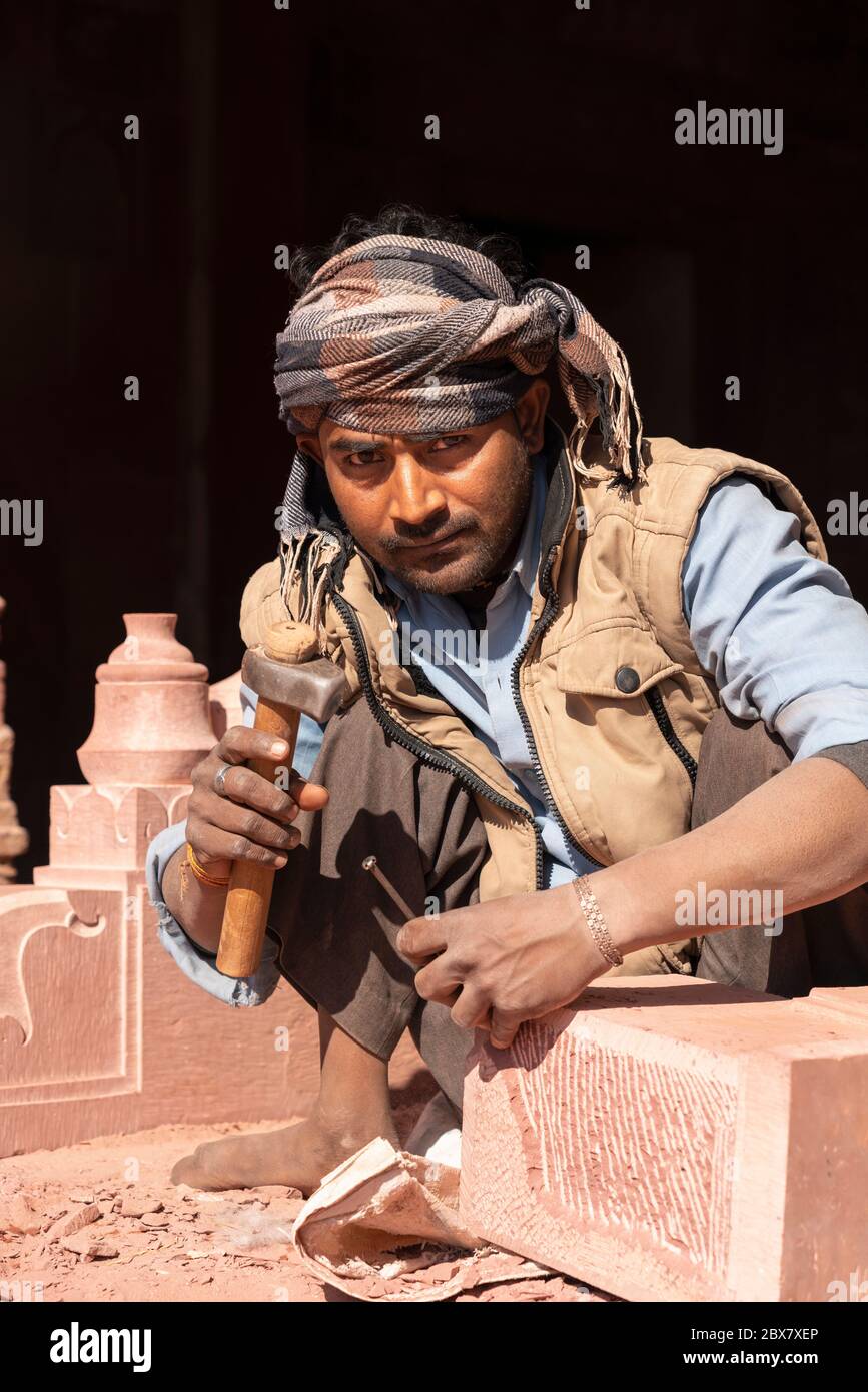 Stone mason pauses for photo at Fatehpur Sikri, India Stock Photo - Alamy