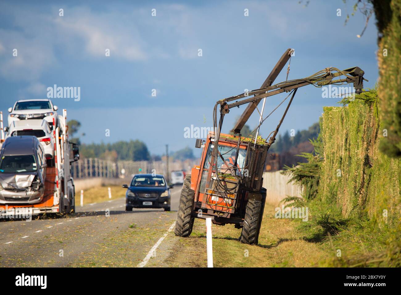 Annat, Canterbury, New Zealand, May 26 2020: A tractor with a hedge ...