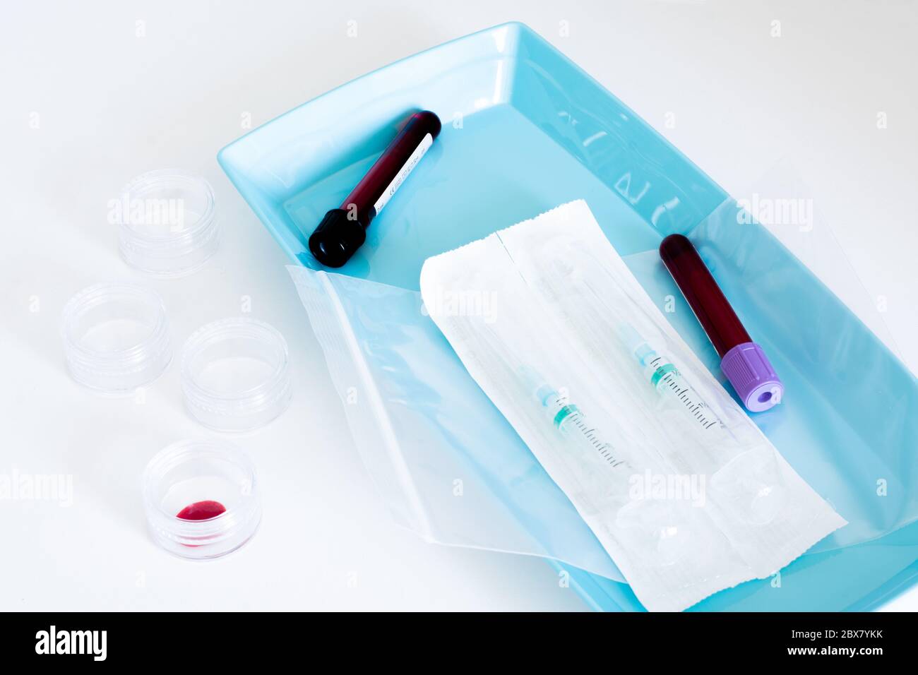 Syringe, two blood tubes Stock Photo - Alamy