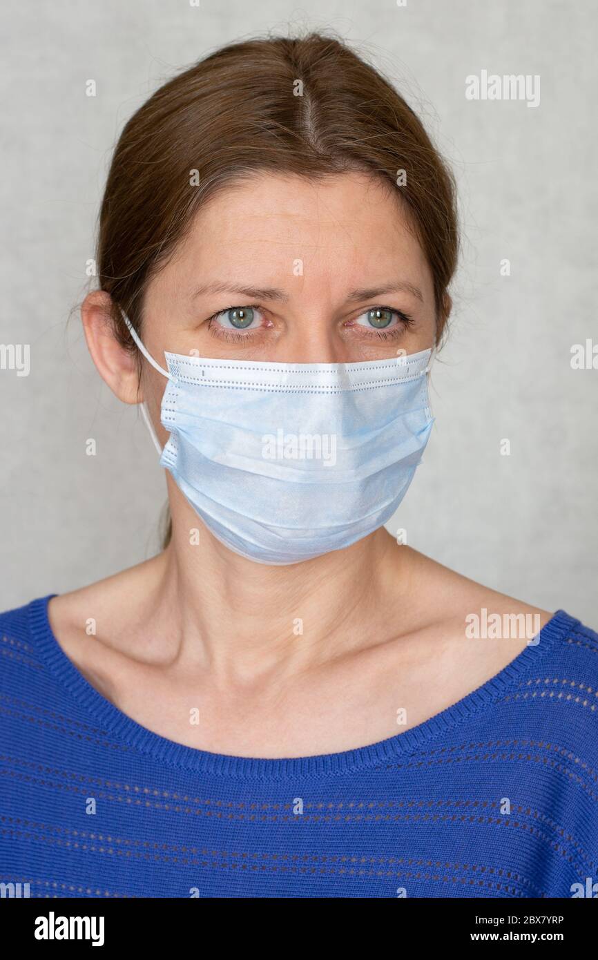 Woman in her fifties wearing a mask Stock Photo - Alamy