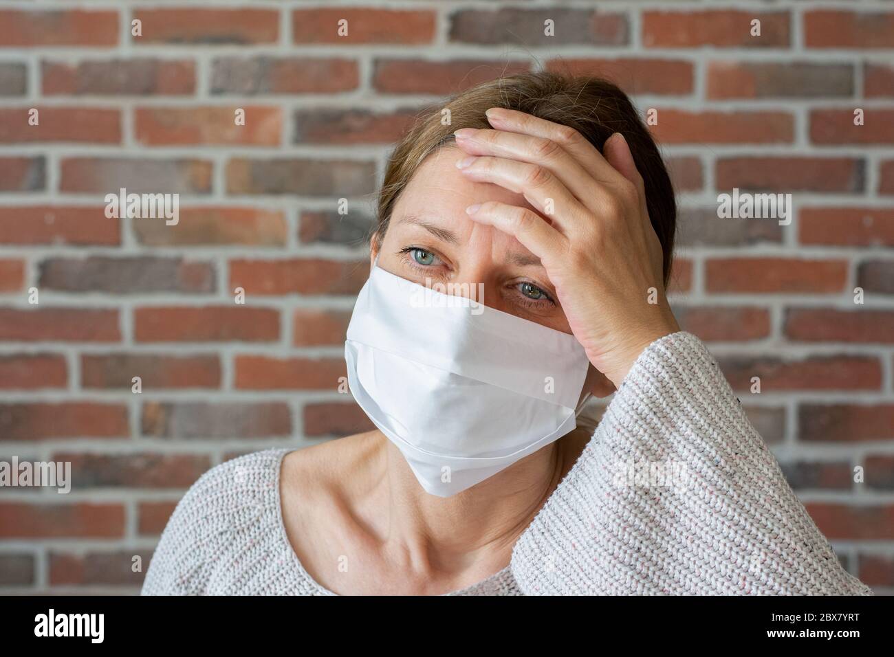 Woman in her fifties wearing a mask Stock Photo - Alamy
