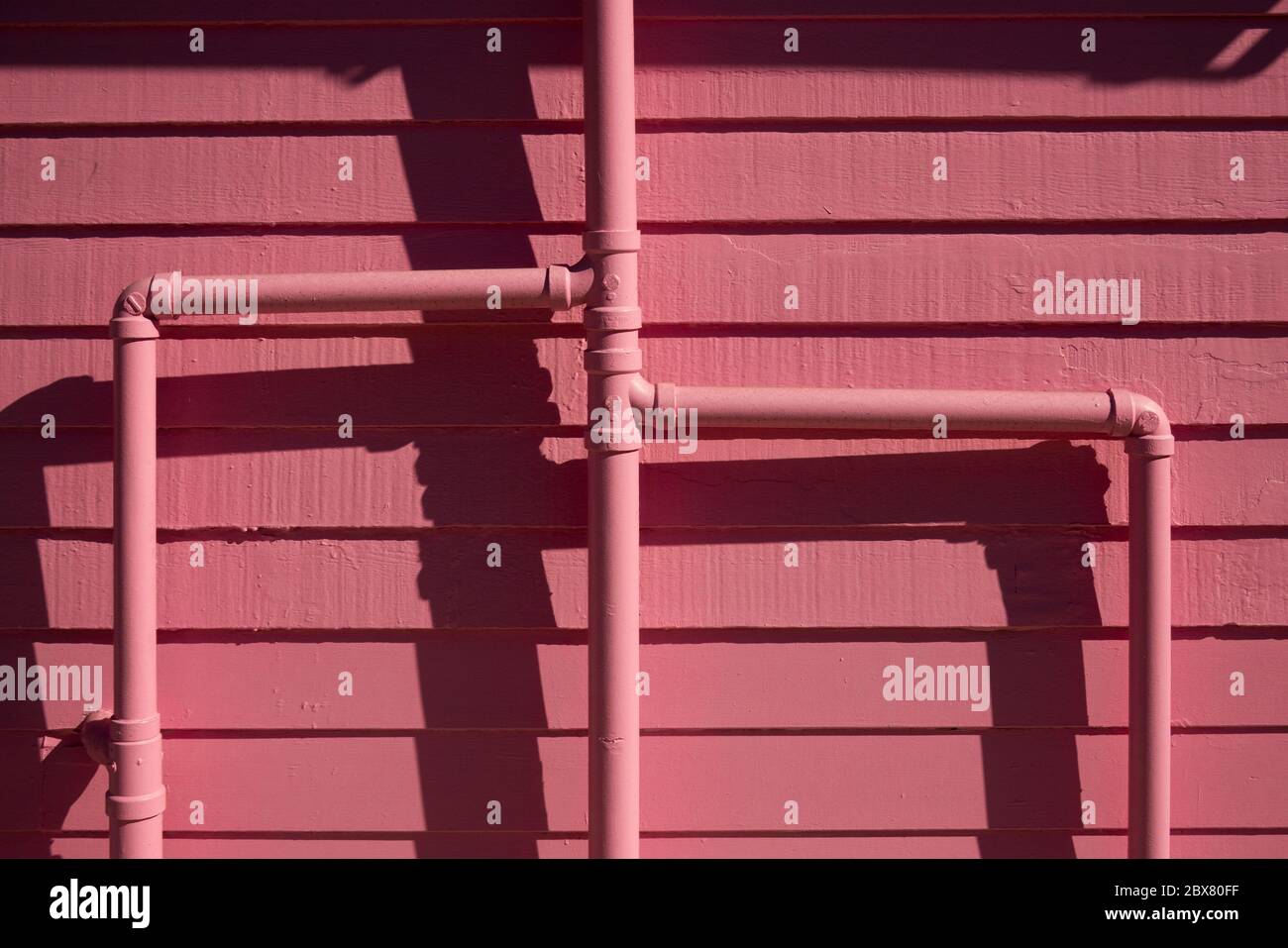 painted pink plumbing pipes on building on Catalina Island CA Stock ...