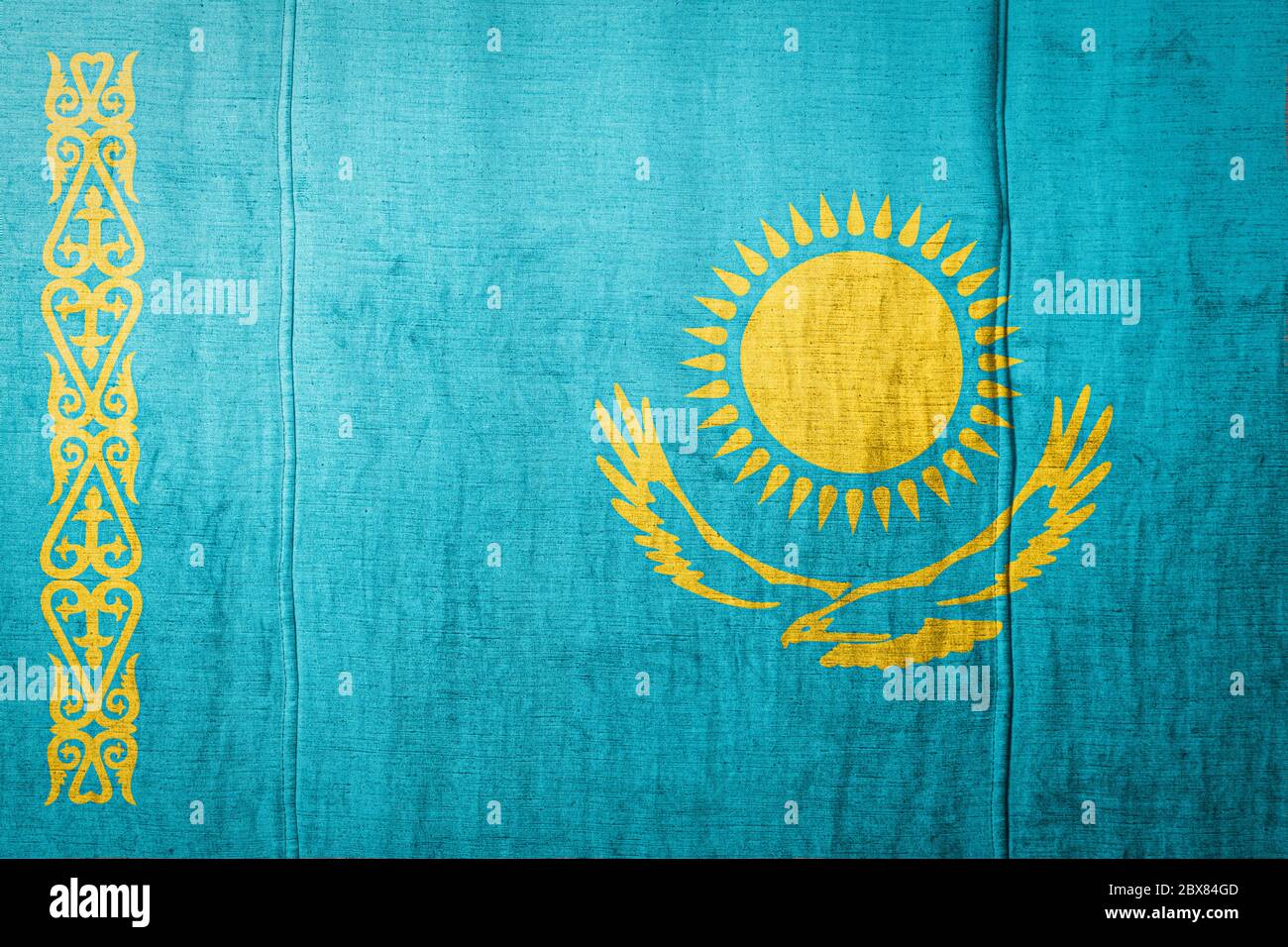 National flag of Kazakhstan depicting in paint colors on old textile ...
