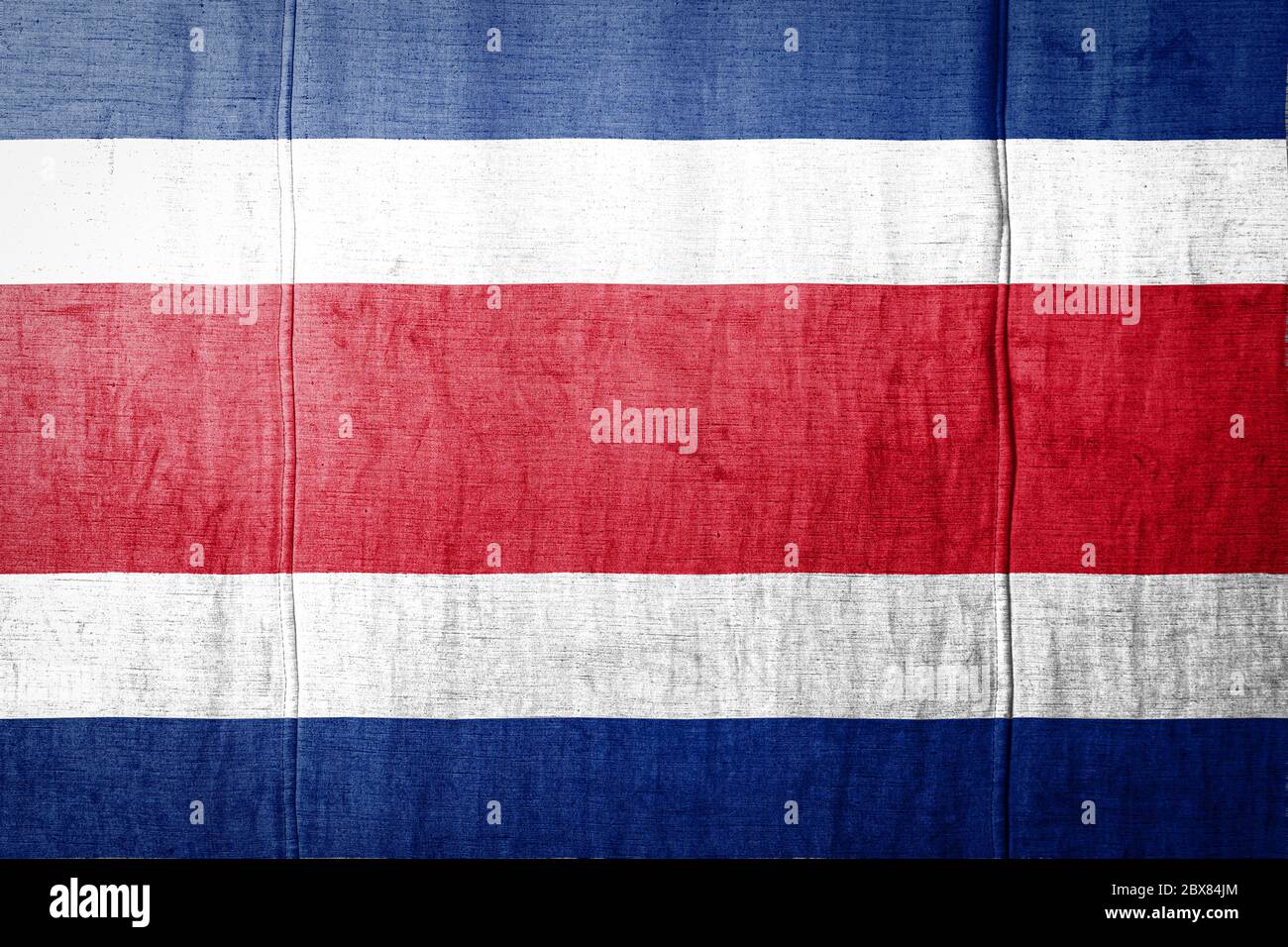 National flag of Costa Rica depicting in paint colors on old textile ...