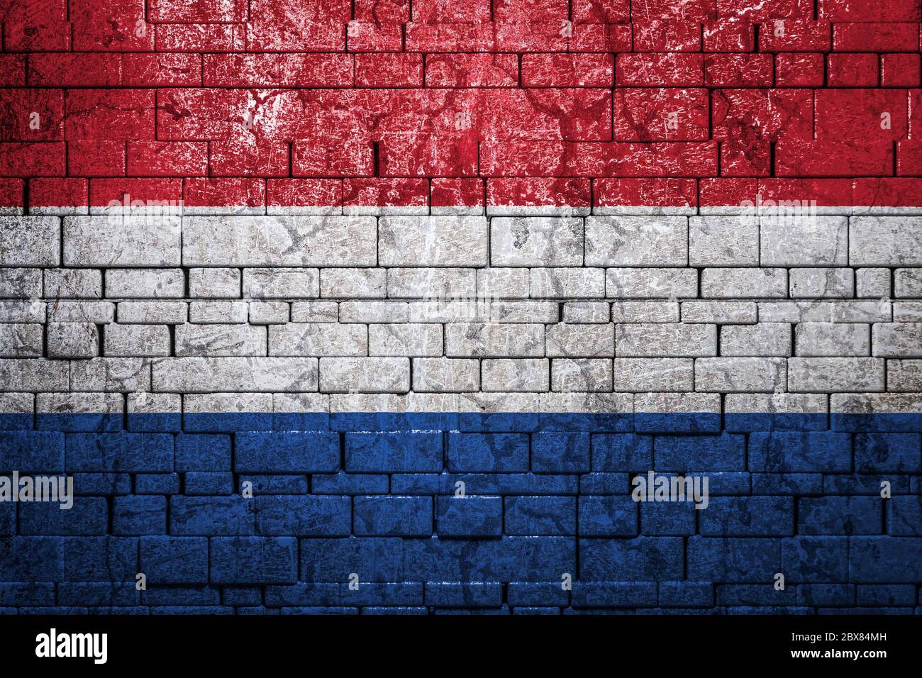 National flag of Netherlands on brick wall background.The concept of ...