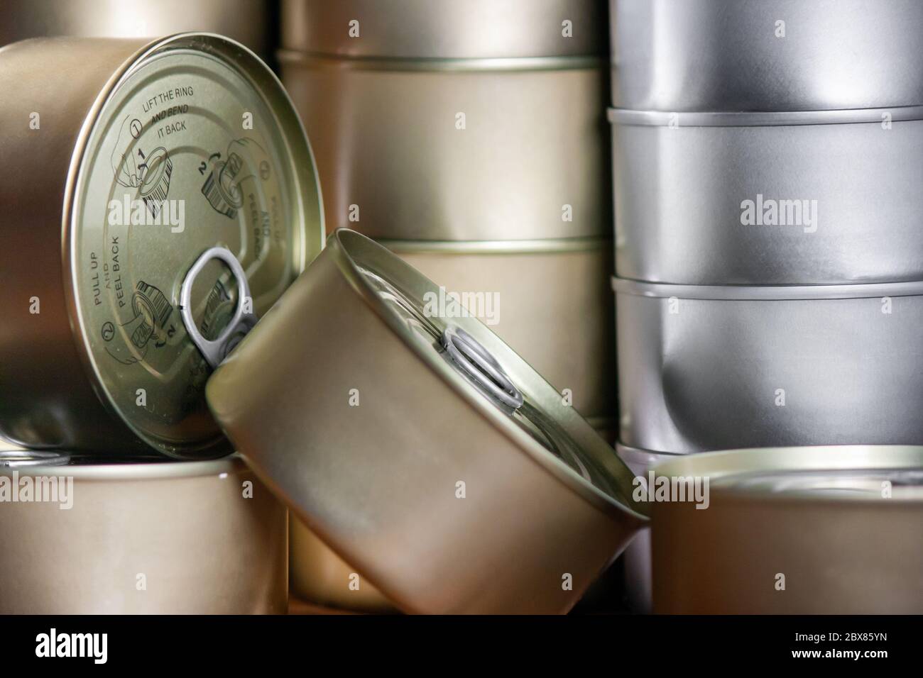 many canned tuna products organized and with a full bottom of cans ...