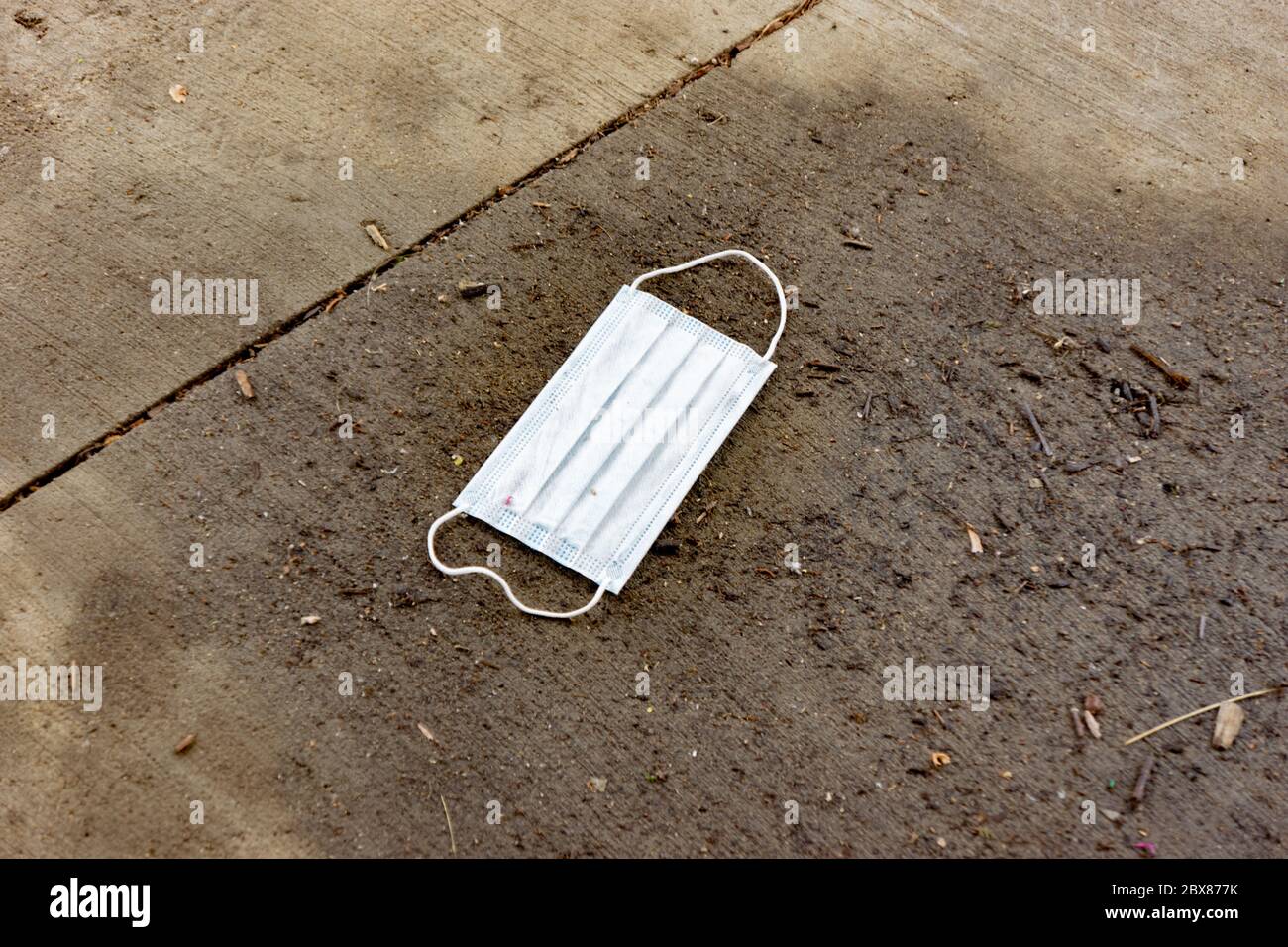 Discarded surgical mask for germ protection. PPE (personal protective ...