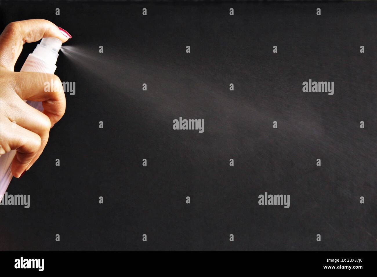 Spraying alcohol on hand hi-res stock photography and images - Alamy