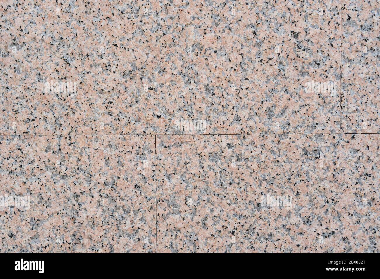 Closeup of granite tile on the wall. Stone beige spotted abstract ...