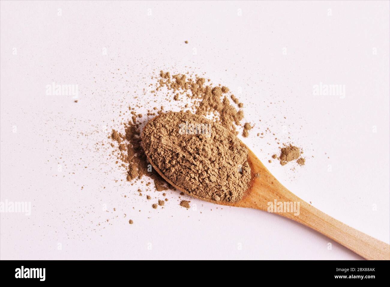 A wooden spoon of herb medicine powder Stock Photo - Alamy