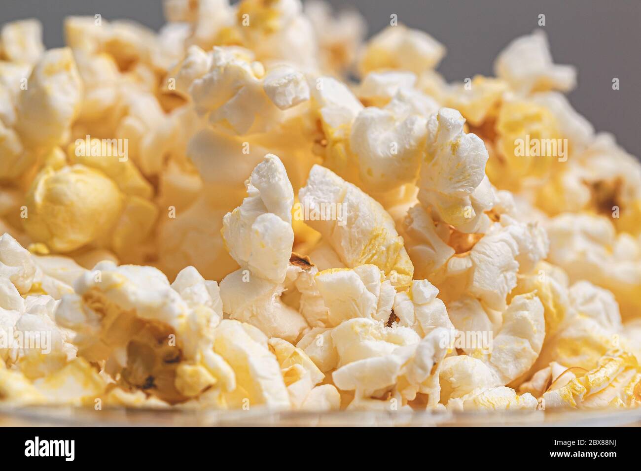 Buttered popcorn in macro photography Stock Photo - Alamy