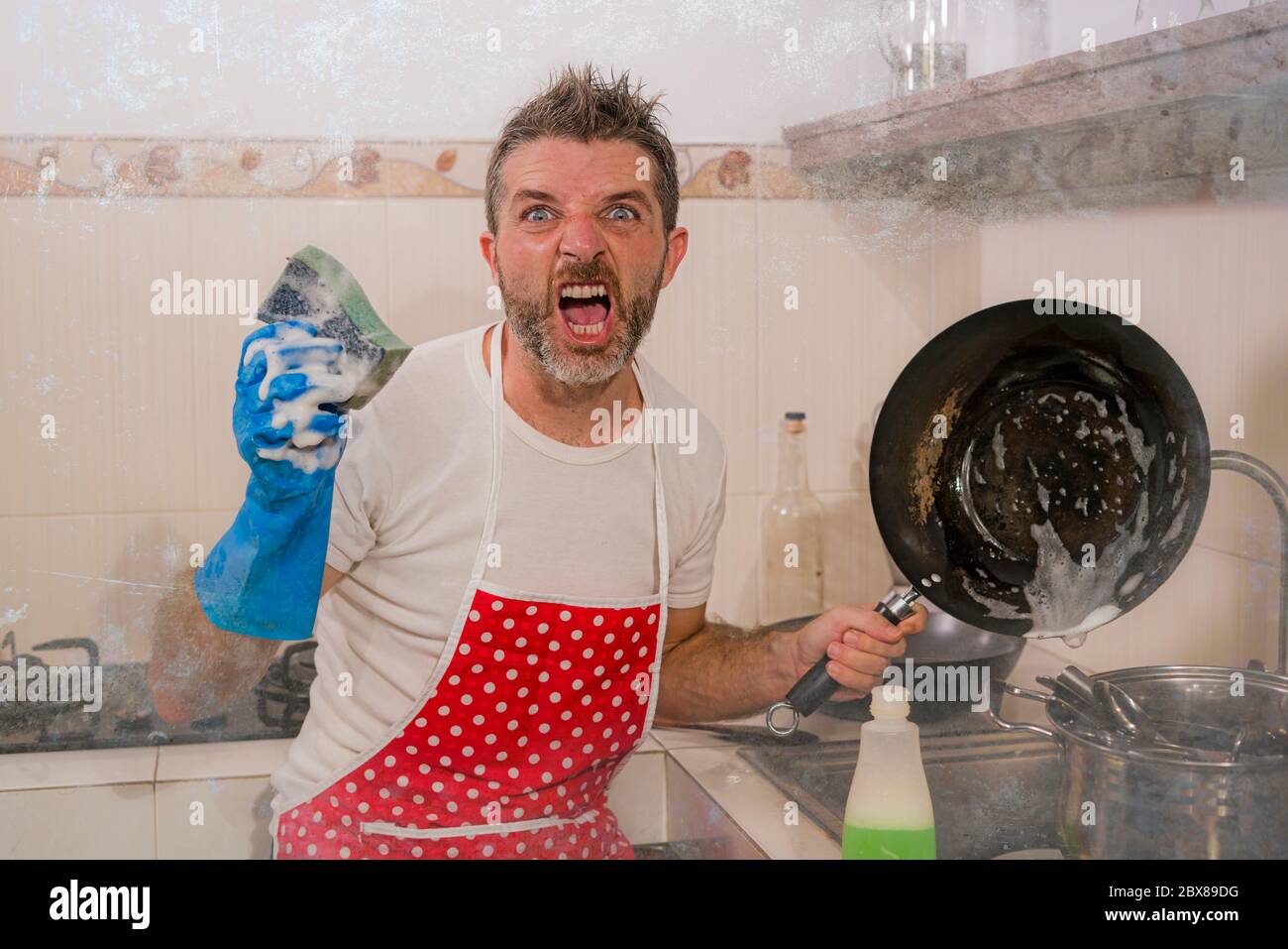 domestic chores stress - lifestyle portrait of young attractive ...