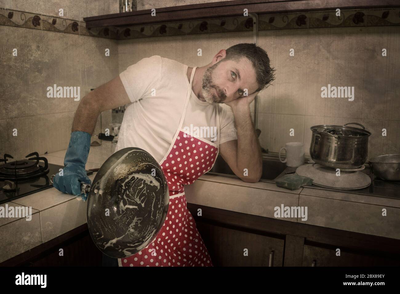 domestic chores stress - lifestyle portrait of young attractive ...