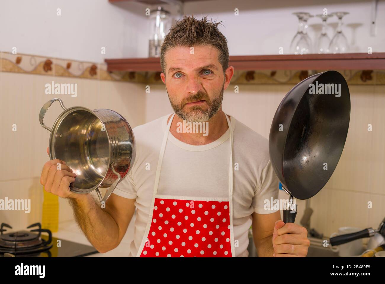 domestic chores stress - lifestyle portrait of young attractive ...