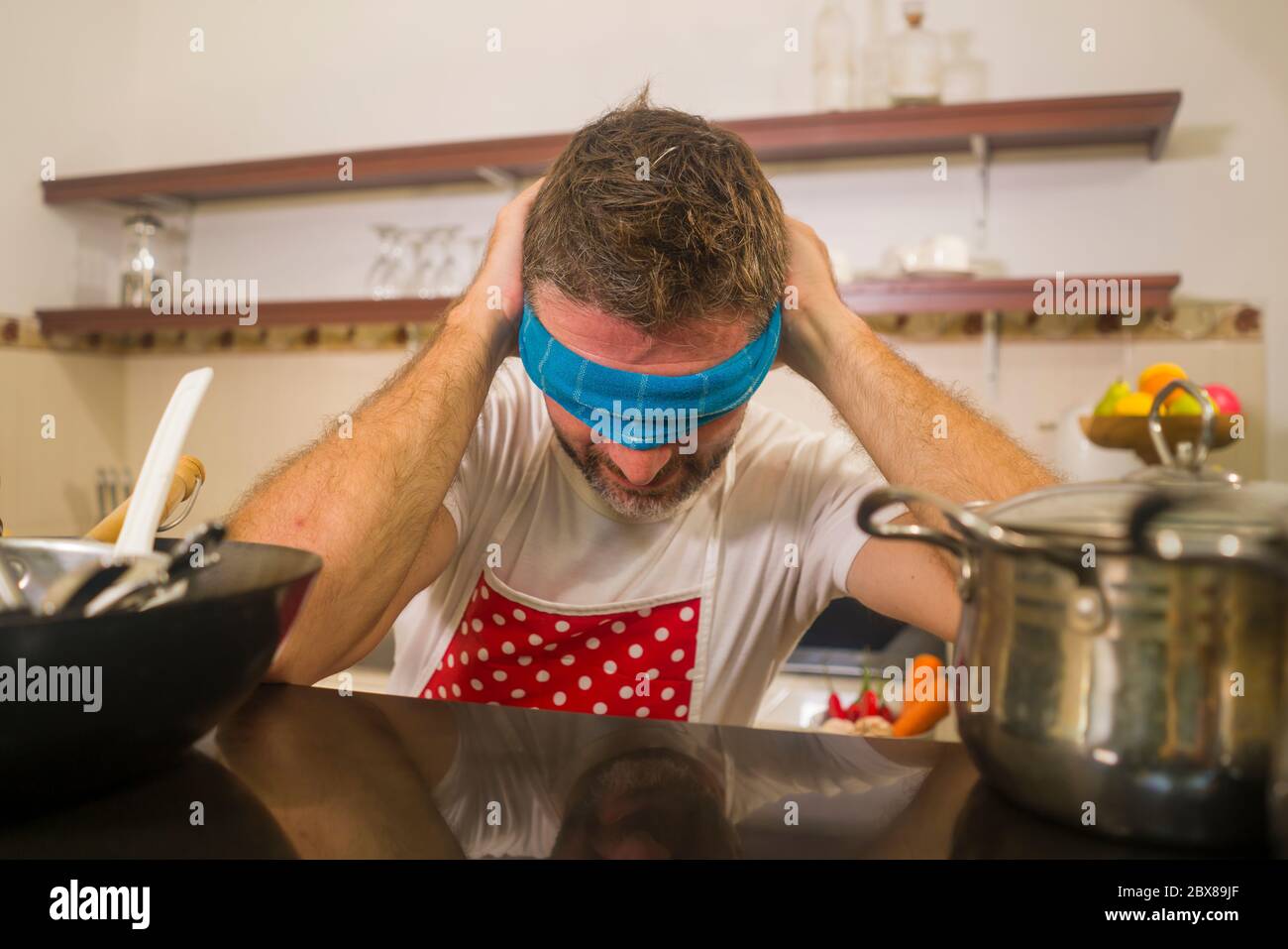 domestic chores stress - young attractive overworked and depressed man ...