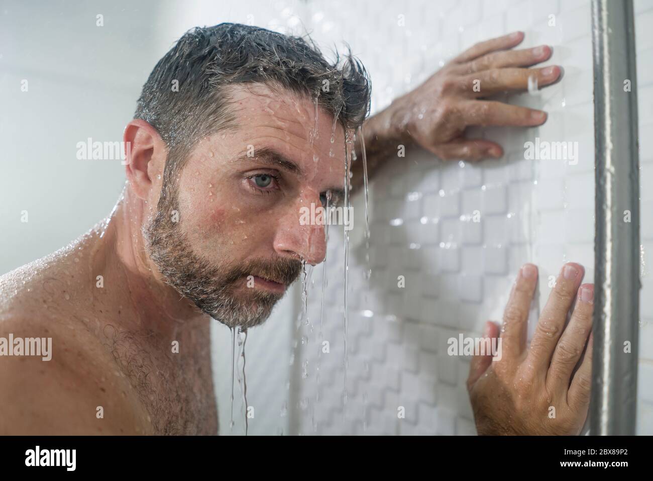 Men showering in bathroom hi-res stock photography and images - Alamy