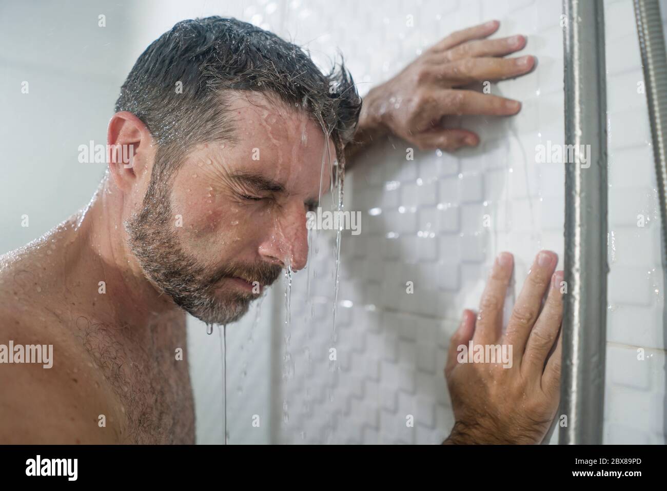 Showering young man hi-res stock photography and images - Alamy