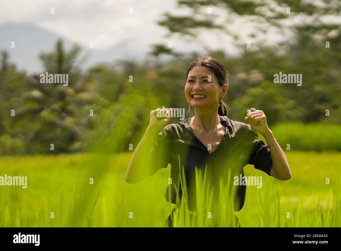 outdoors portrait of attractive and happy Asian Chinese woman 40s or ...
