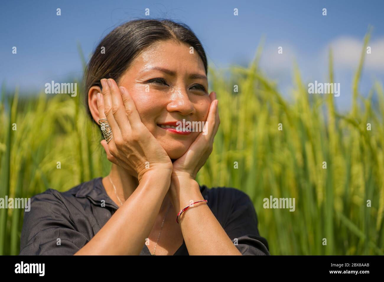 outdoors portrait of attractive and happy Asian Chinese woman 40s or ...