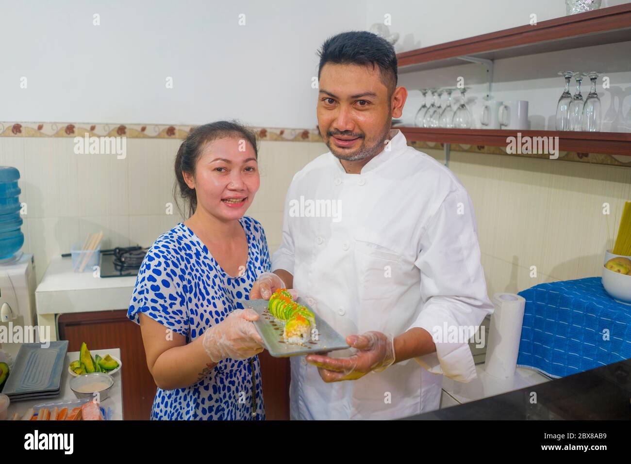 Couple making sushi hi-res stock photography and images - Alamy