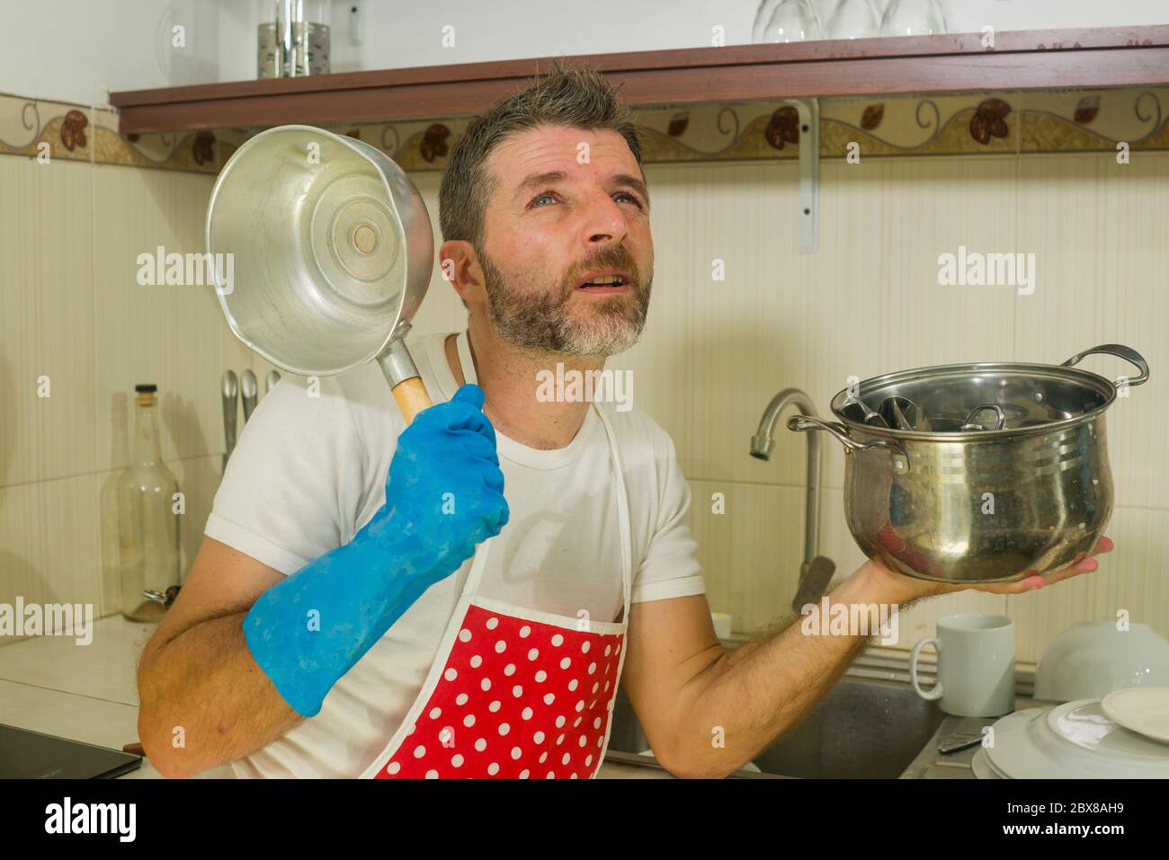 domestic chores stress - lifestyle portrait of young attractive ...