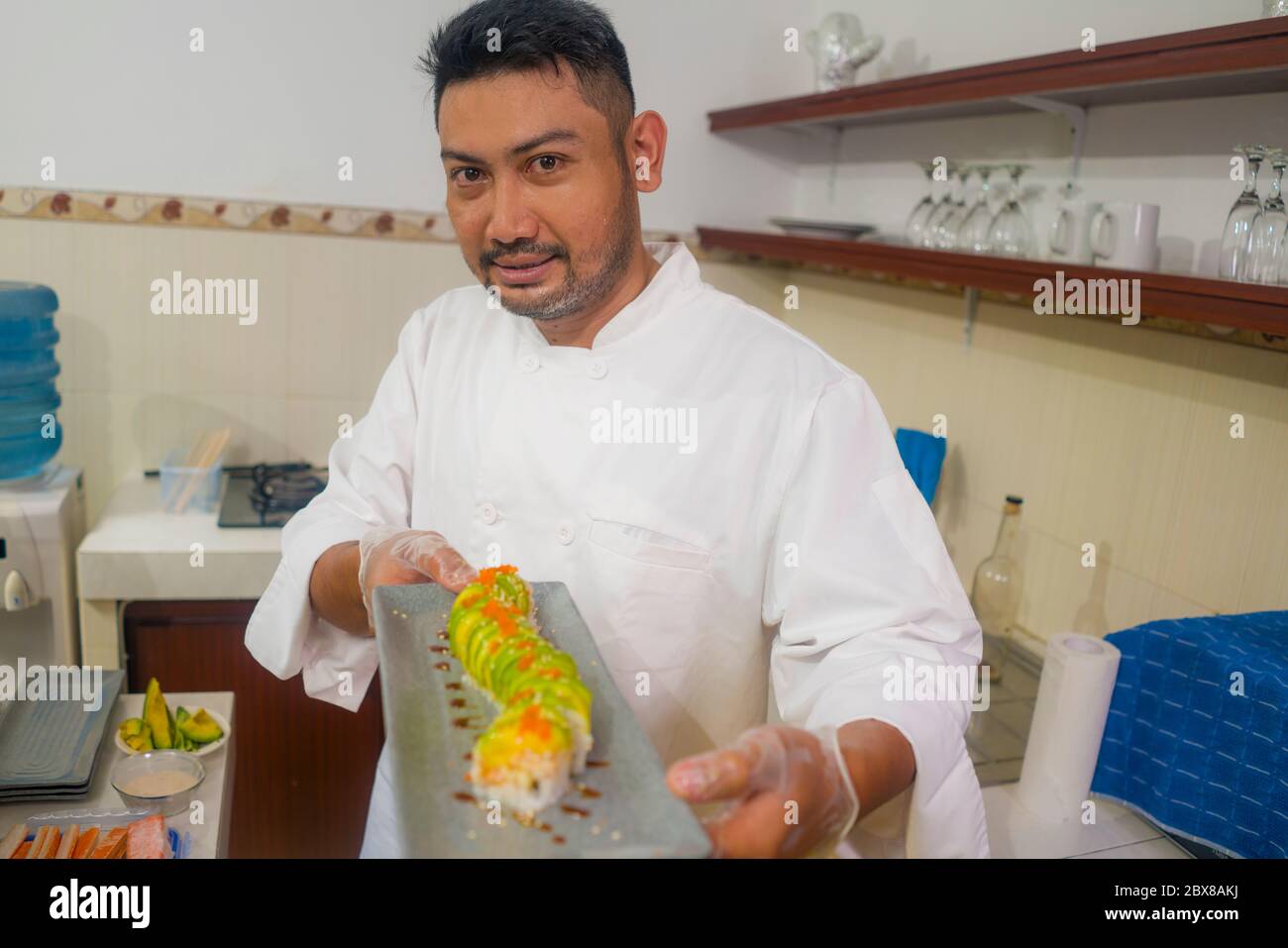 lifestyle portrait of Asian home cook man or professional chef cooking ...