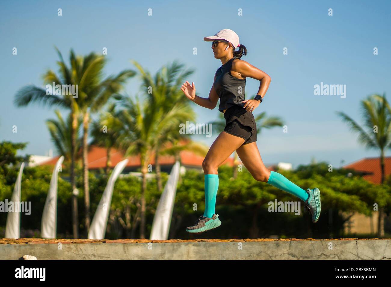 outdoors fitness portrait of young attractive and athletic woman ...