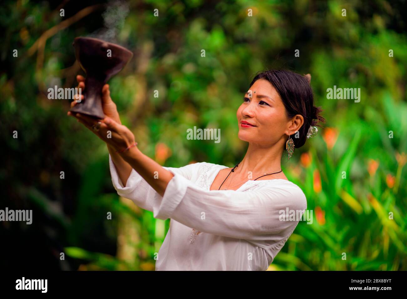 mind and body connection - beautiful and happy healer Asian woman ...
