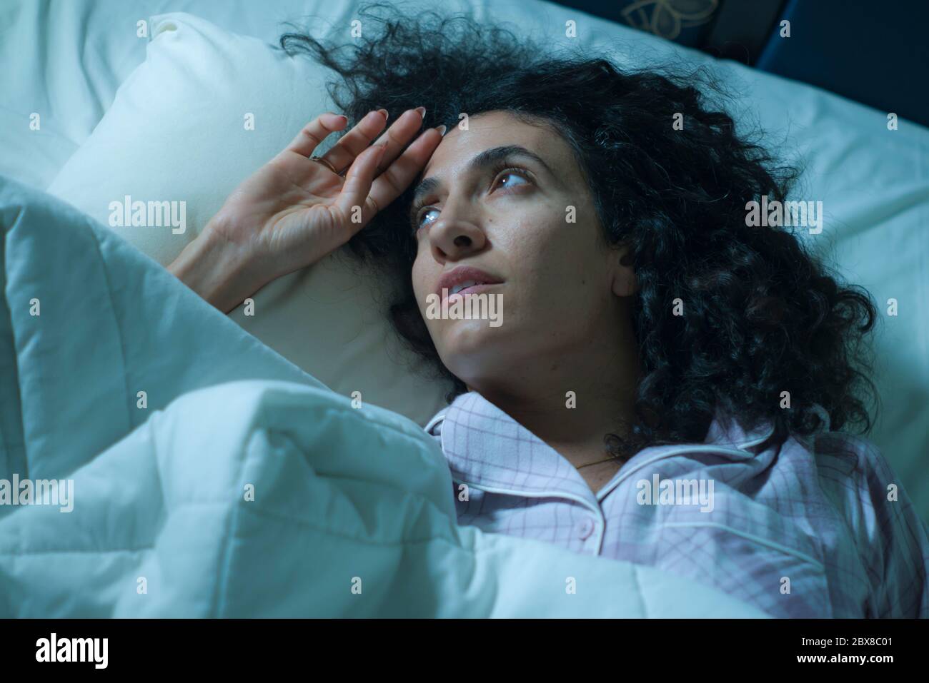 dramatic night lifestyle potrait of young sad and depressed middle ...