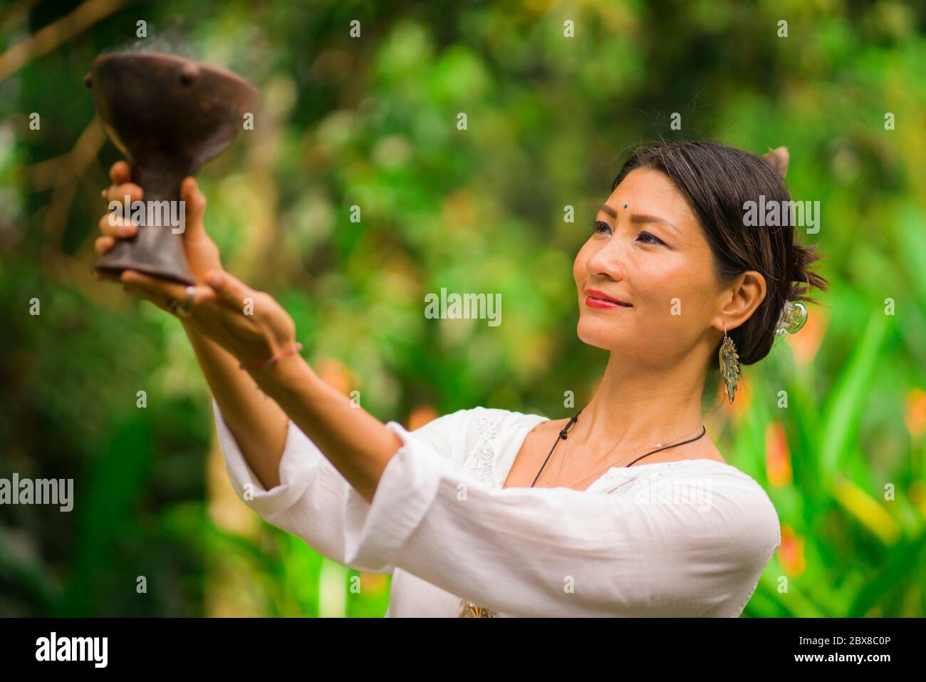 mind and body connection - beautiful and happy healer Asian woman ...