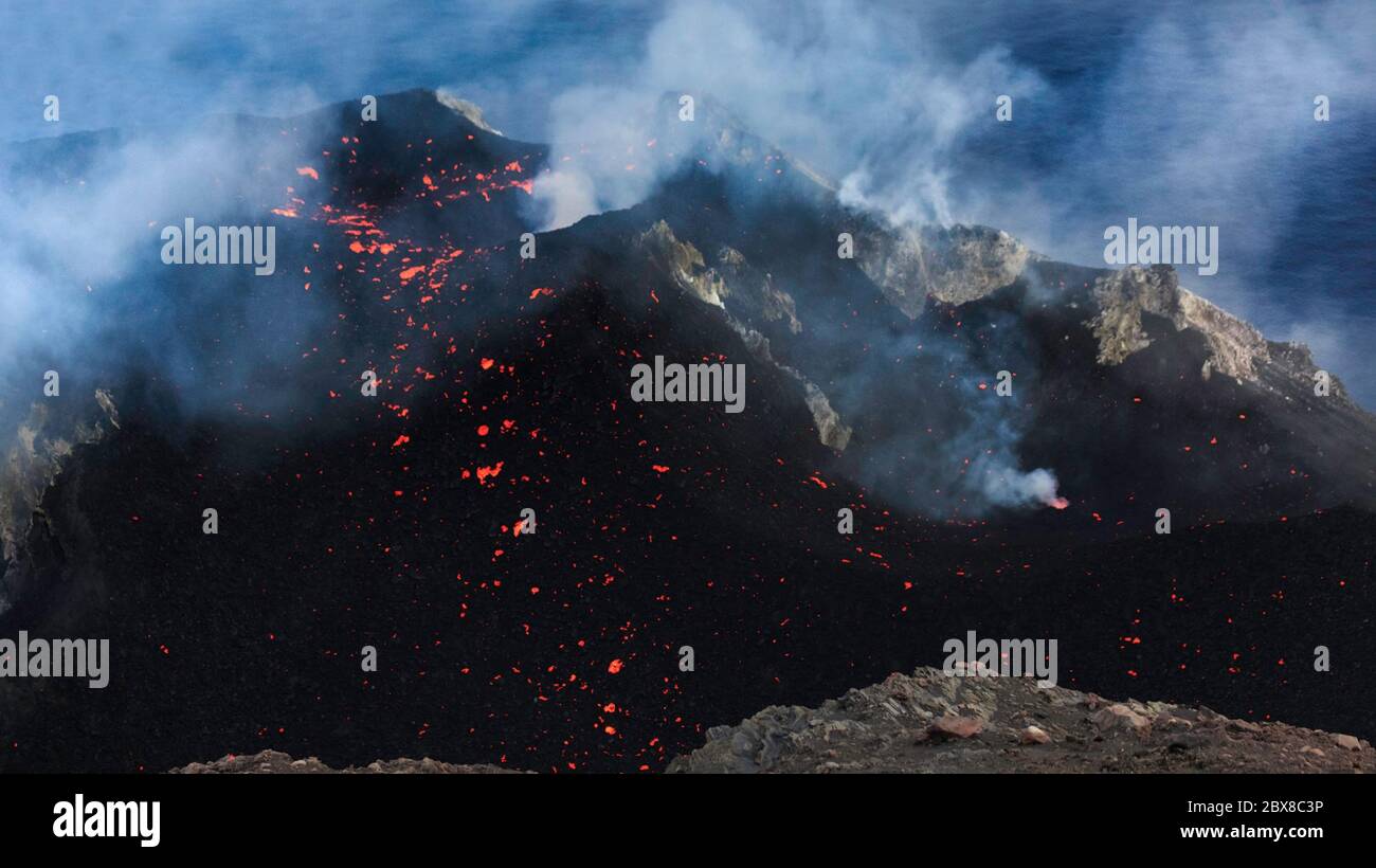 Stromboli top crater with lava sketch and smoke ,sea in background at ...