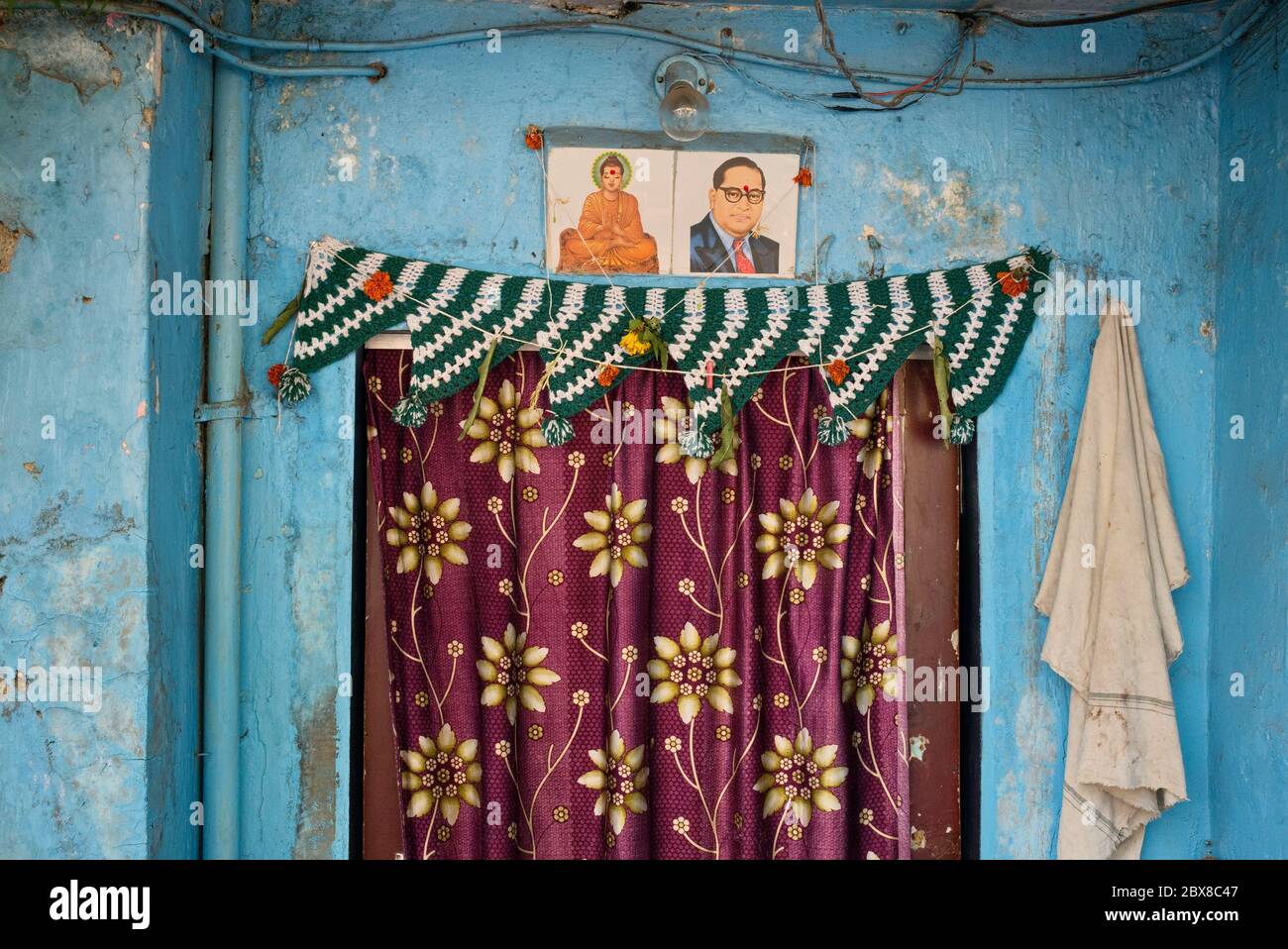 The entrance of a small slum house or jhopra in Mumbai, India, the ...